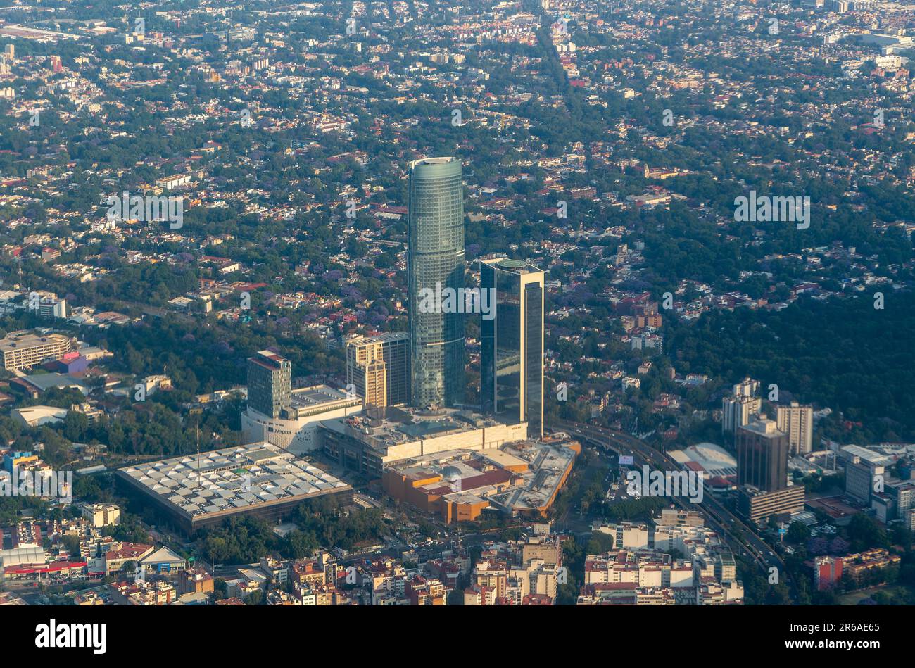 Oblique angle view through plane window new high rise buildings ...