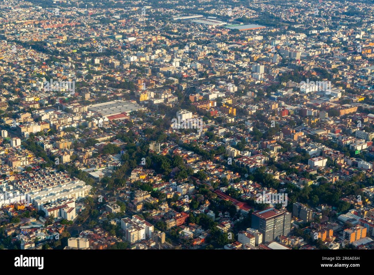 Oblique angle aerial view through plane window over Mexico City, Mexico ...