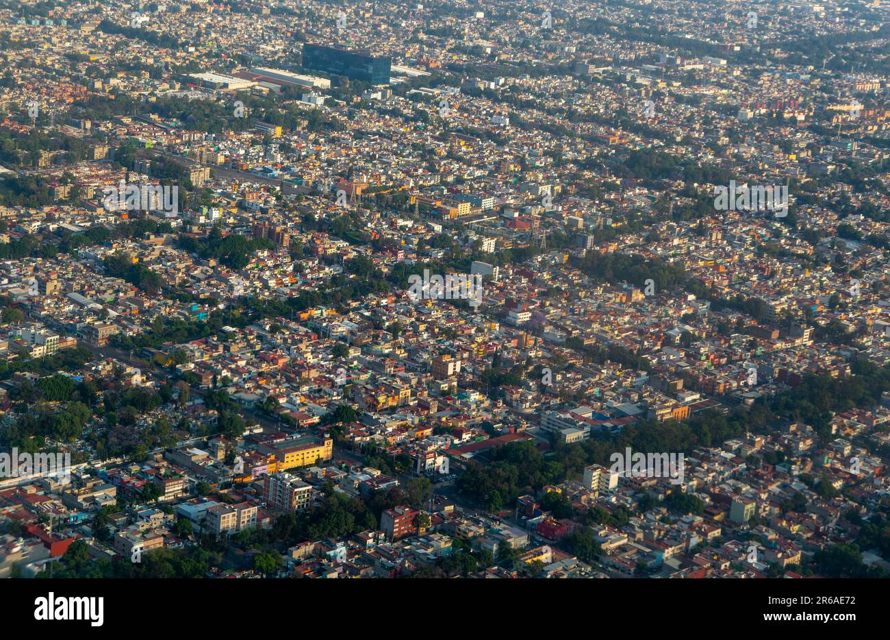 Oblique angle aerial view through plane window over Mexico City, Mexico ...