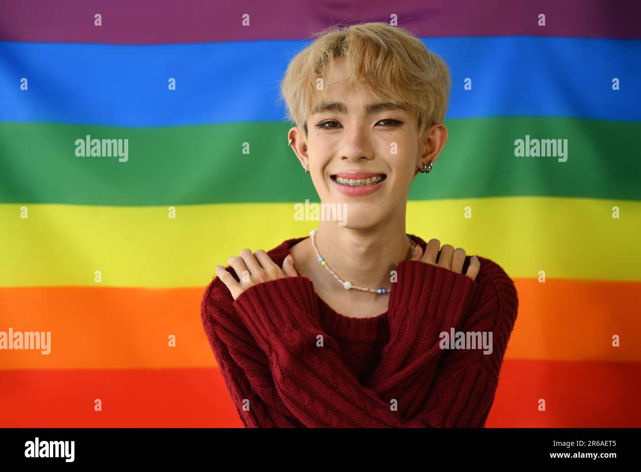 Cheerful Homosexual Young Gay Man Posing Over Rainbow Pride Flag Background Lgbtq Human Rights
