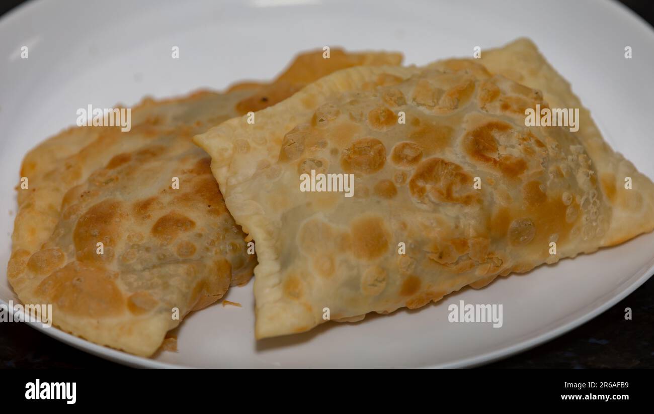 Traditional homemade rustic Brazilian pastry stuffed with ground meat ...