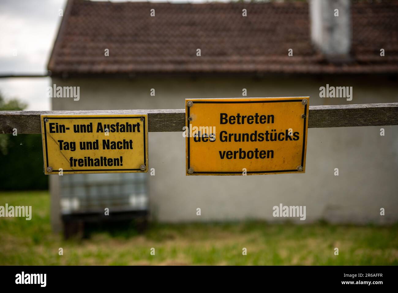 Signs in german at the entrance of an empty lot saying no entry and ...