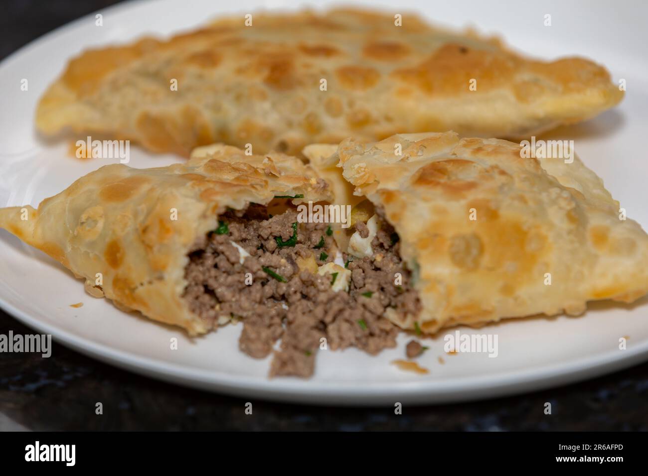 Traditional homemade rustic Brazilian pastry stuffed with ground meat ...