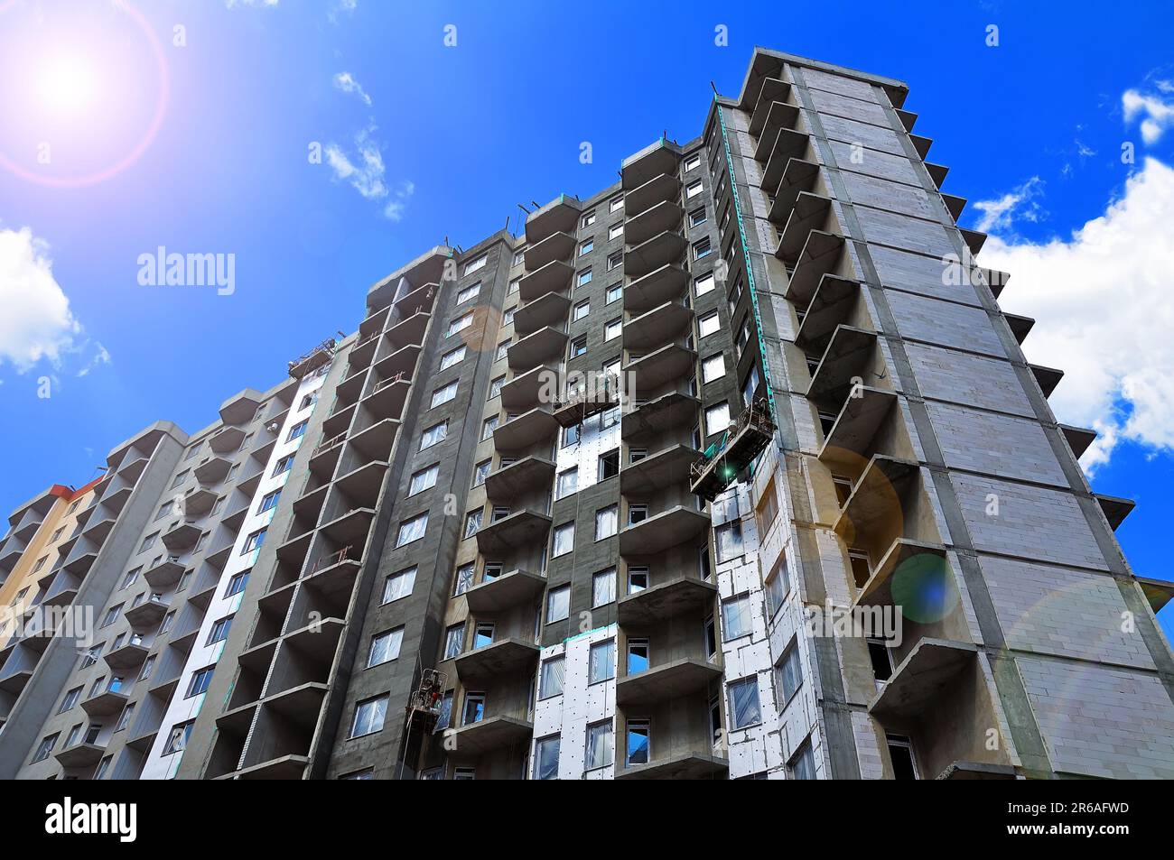 Construction site multi-storey building on sky background Stock Photo ...