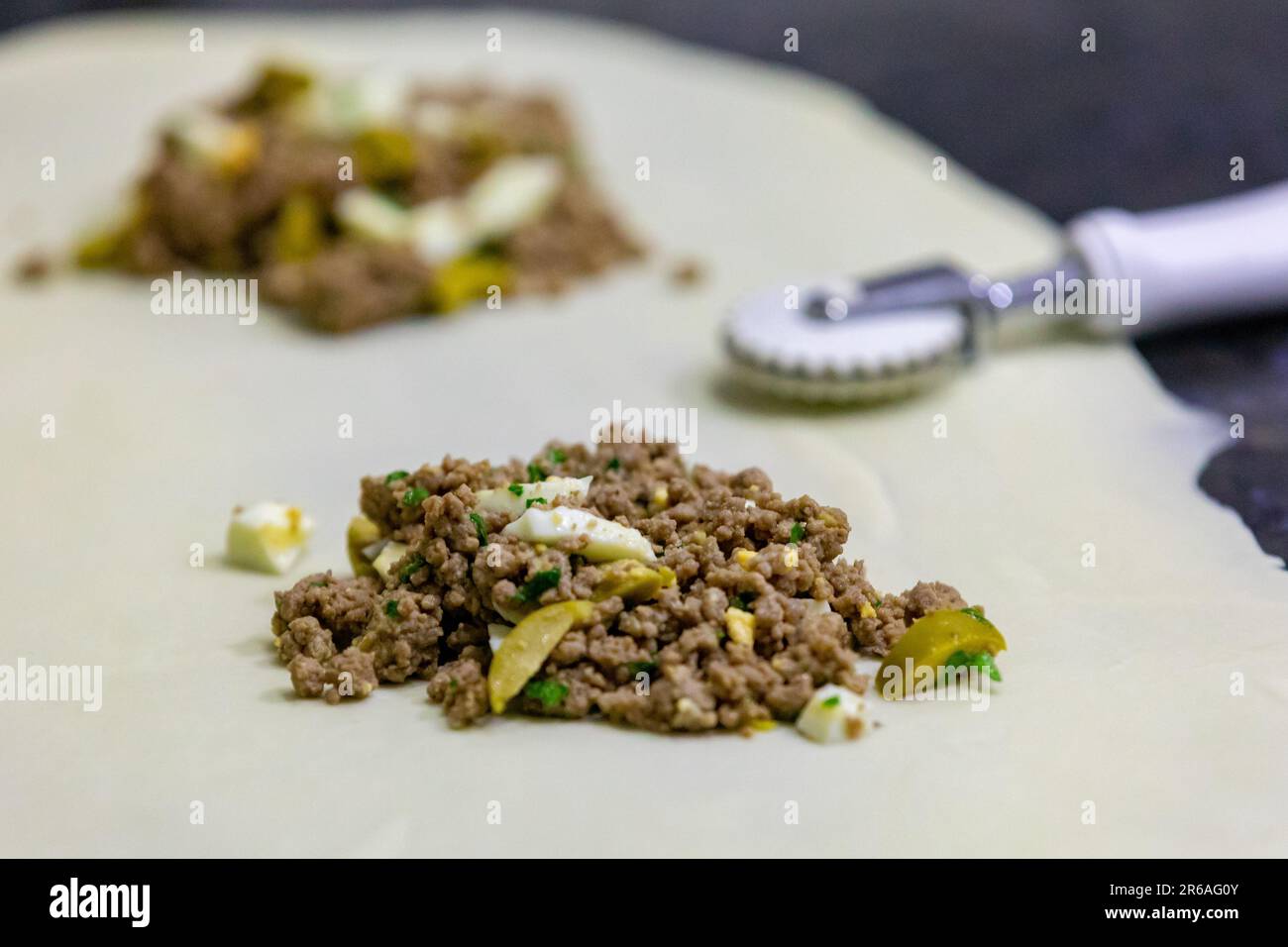 Traditional homemade rustic Brazilian pastry stuffed with ground meat ...