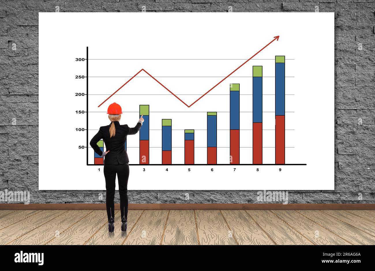 engineer woman in office pointing to poster with chart Stock Photo - Alamy