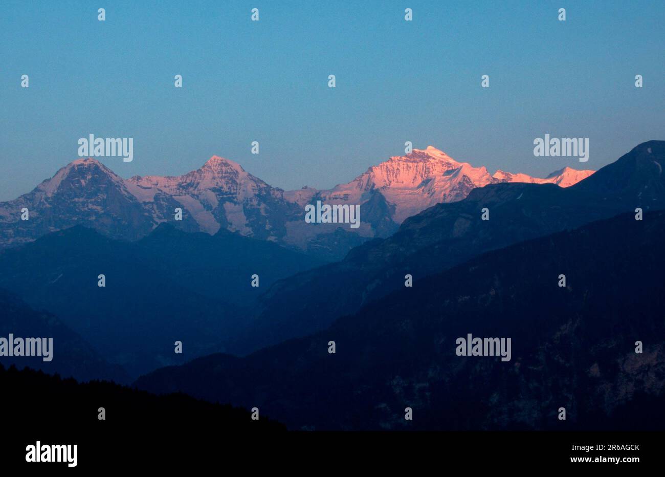 Eiger, Moench and Jungfrau, view from Beatenberg, Switzerland (dusk ...