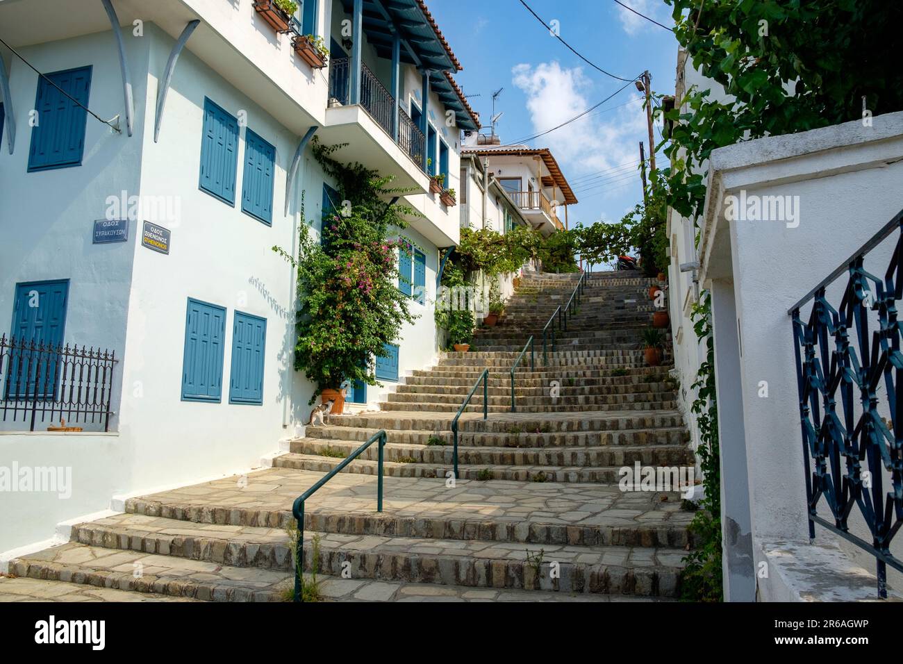 A vibrant street scene featuring a set of stairs adjacent to a cluster ...