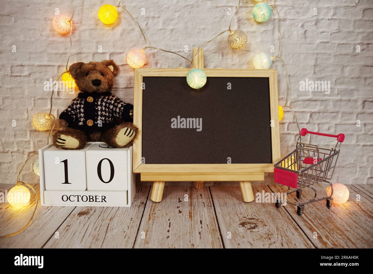 10 October text message with alarm clock and trolly shopping cart on ...