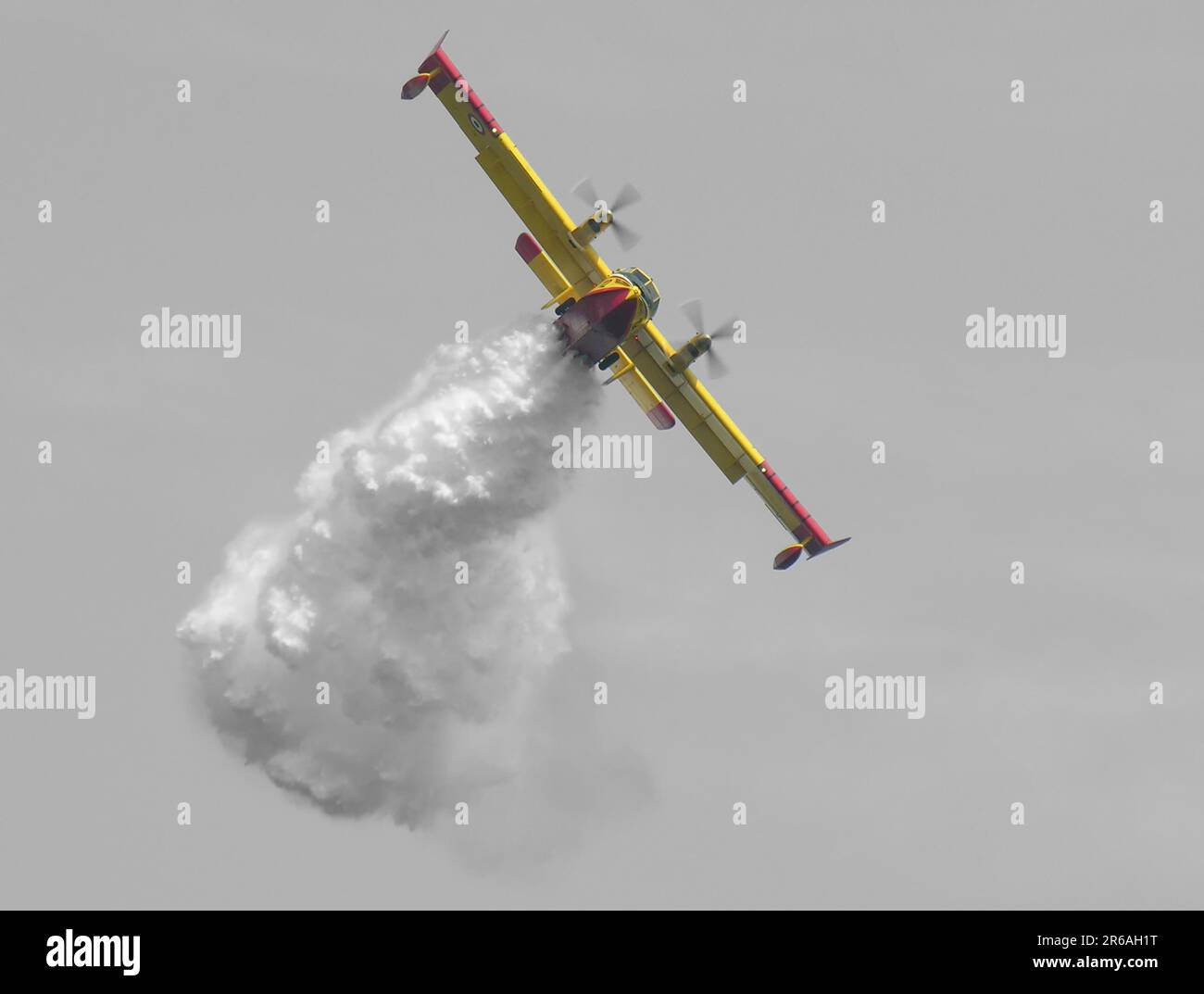 Firefighter plane drops water Stock Photo - Alamy