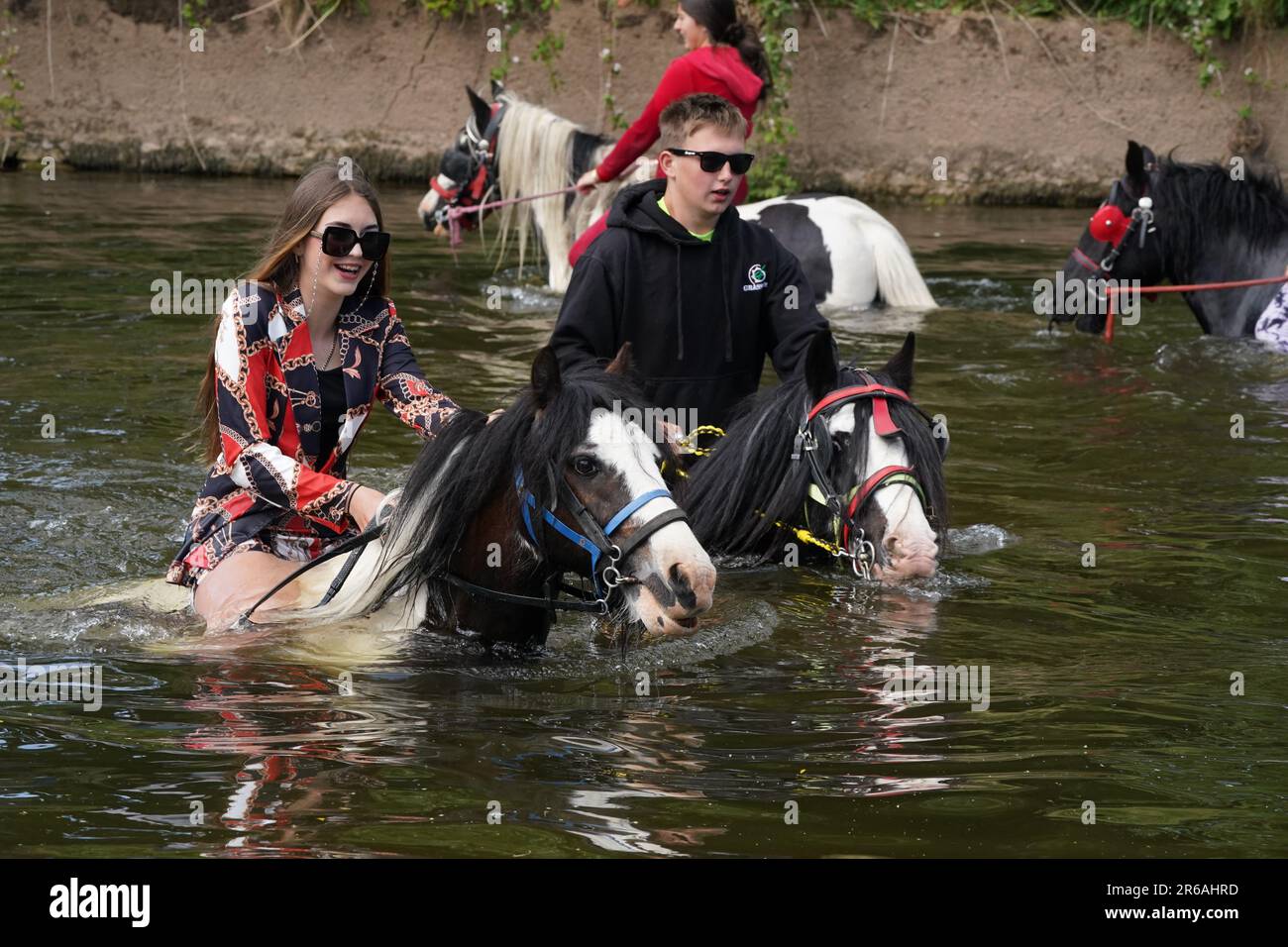 People ride their horses through the river during the Appleby Horse ...