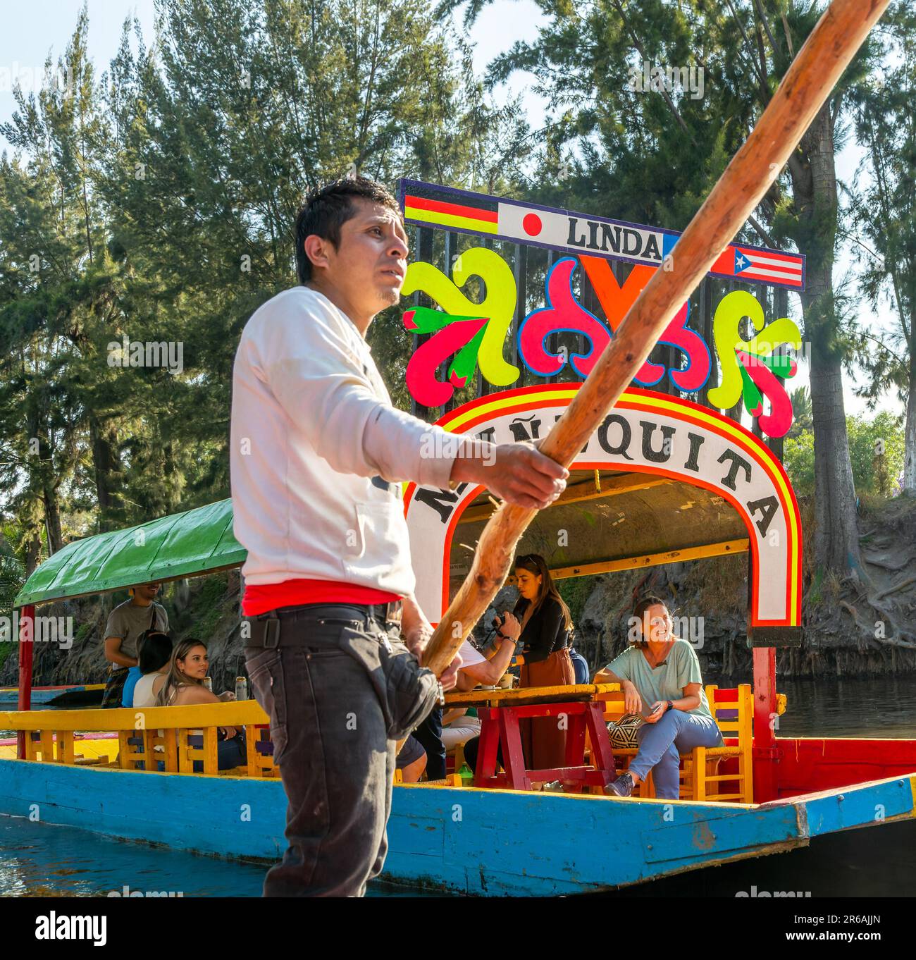 Popular tourist attraction people boating on colourful barges on canal ...
