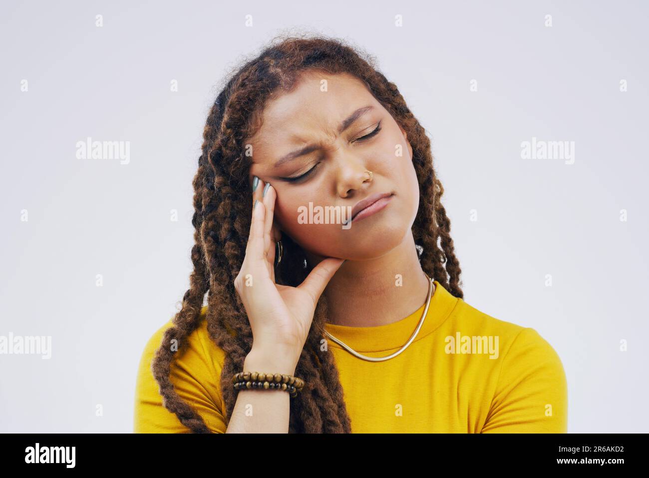 Headache, stress and gen z girl in studio with pain, problem and crisis ...
