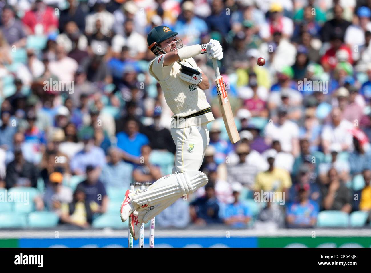 Australia's Travis Head leaps out of the way of a short ball bowled by ...