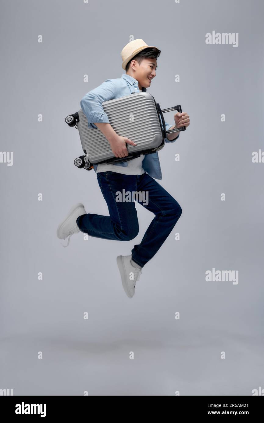 Full length side view of cheerful traveler tourist man in summer ...