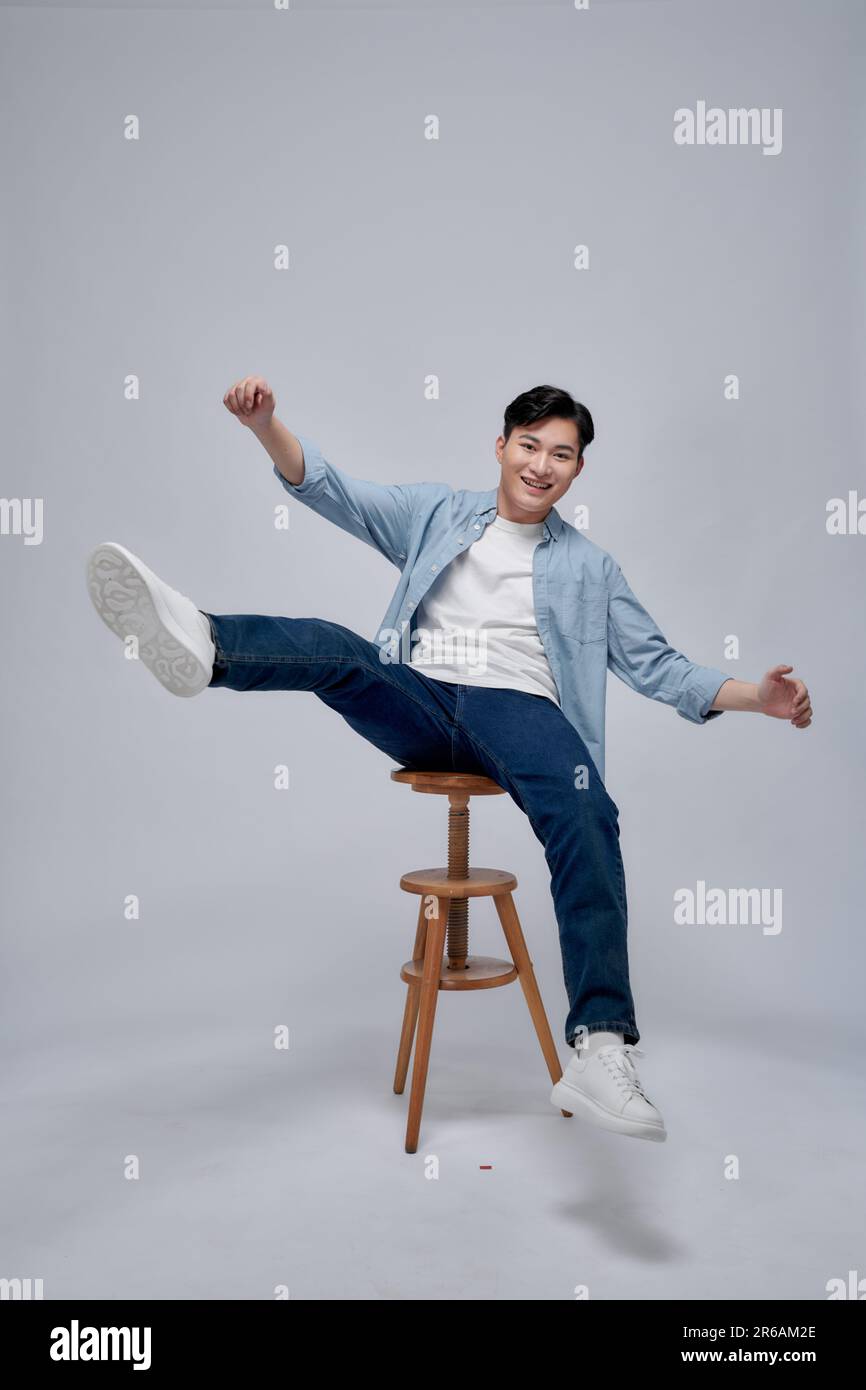 man sitting on a bar stool Stock Photo - Alamy