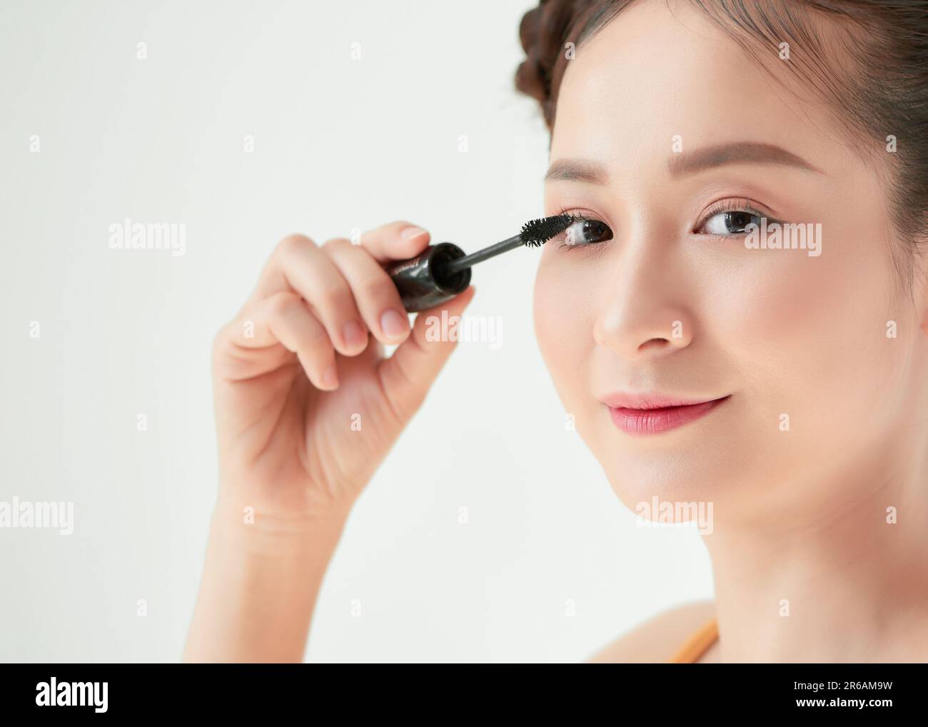 beautiful young woman applied mascara, studio beauty portrait Stock ...