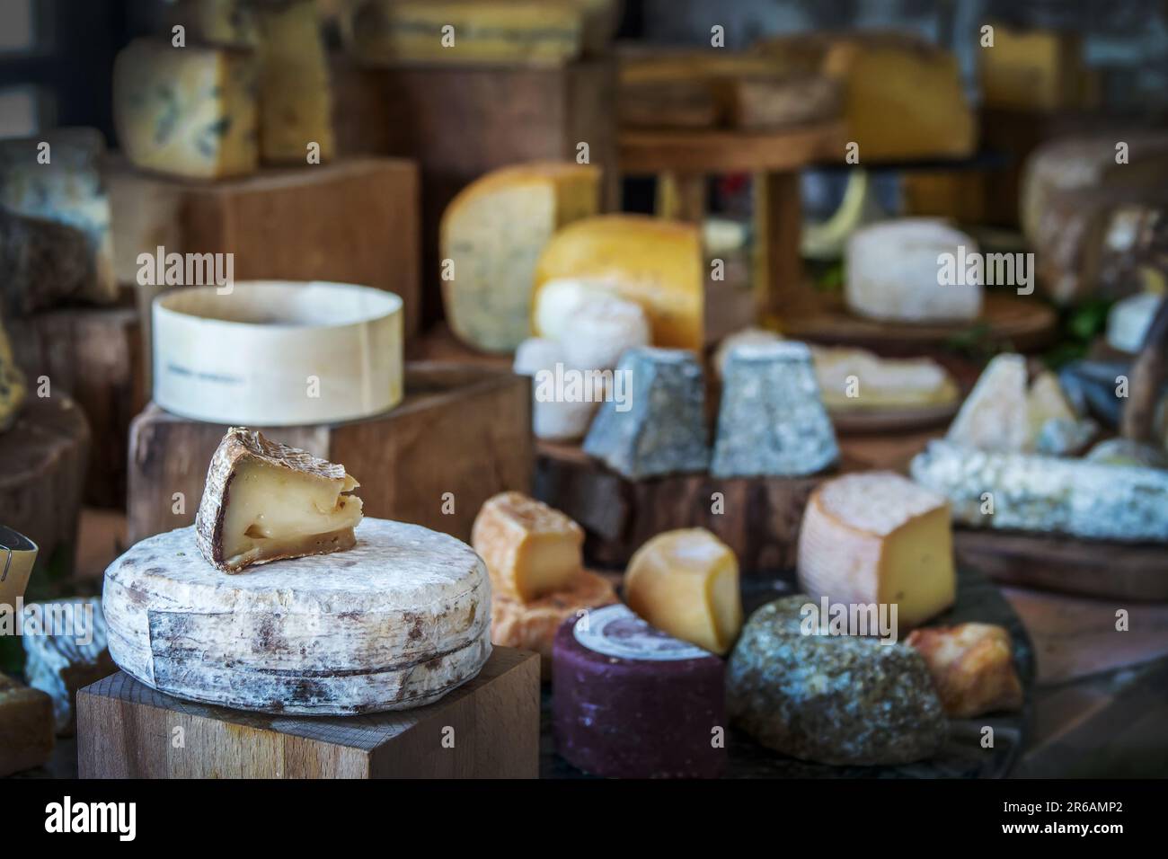 Large choice of French ripened cheese on a wooden rustic board Stock ...