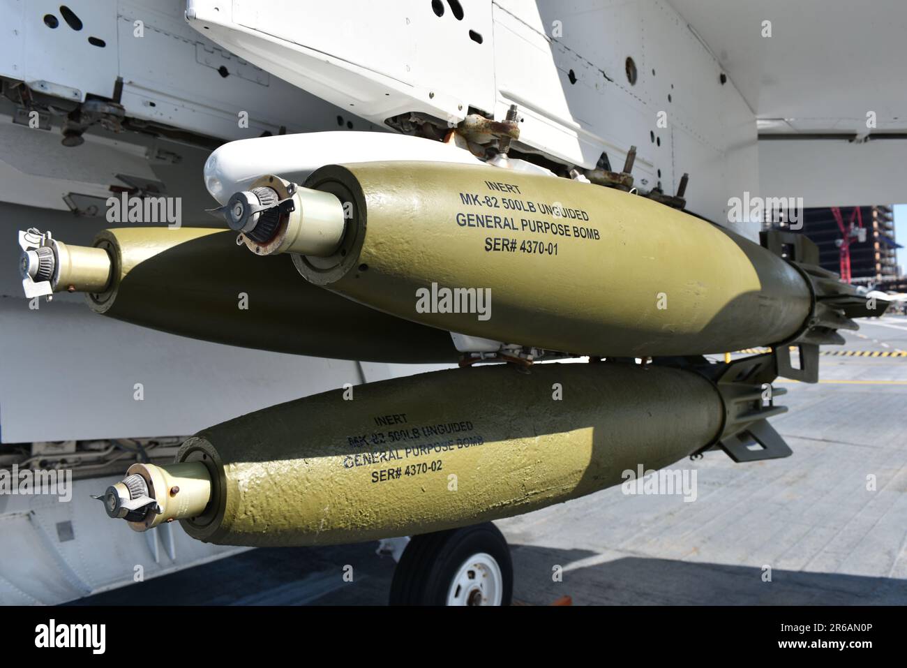 A small military aircraft loaded with bombs Stock Photo - Alamy