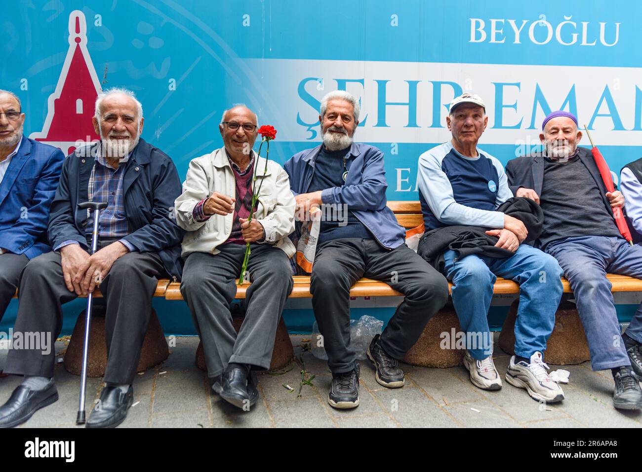 Old turkis men sitting together smiling and chatting in a street in ...