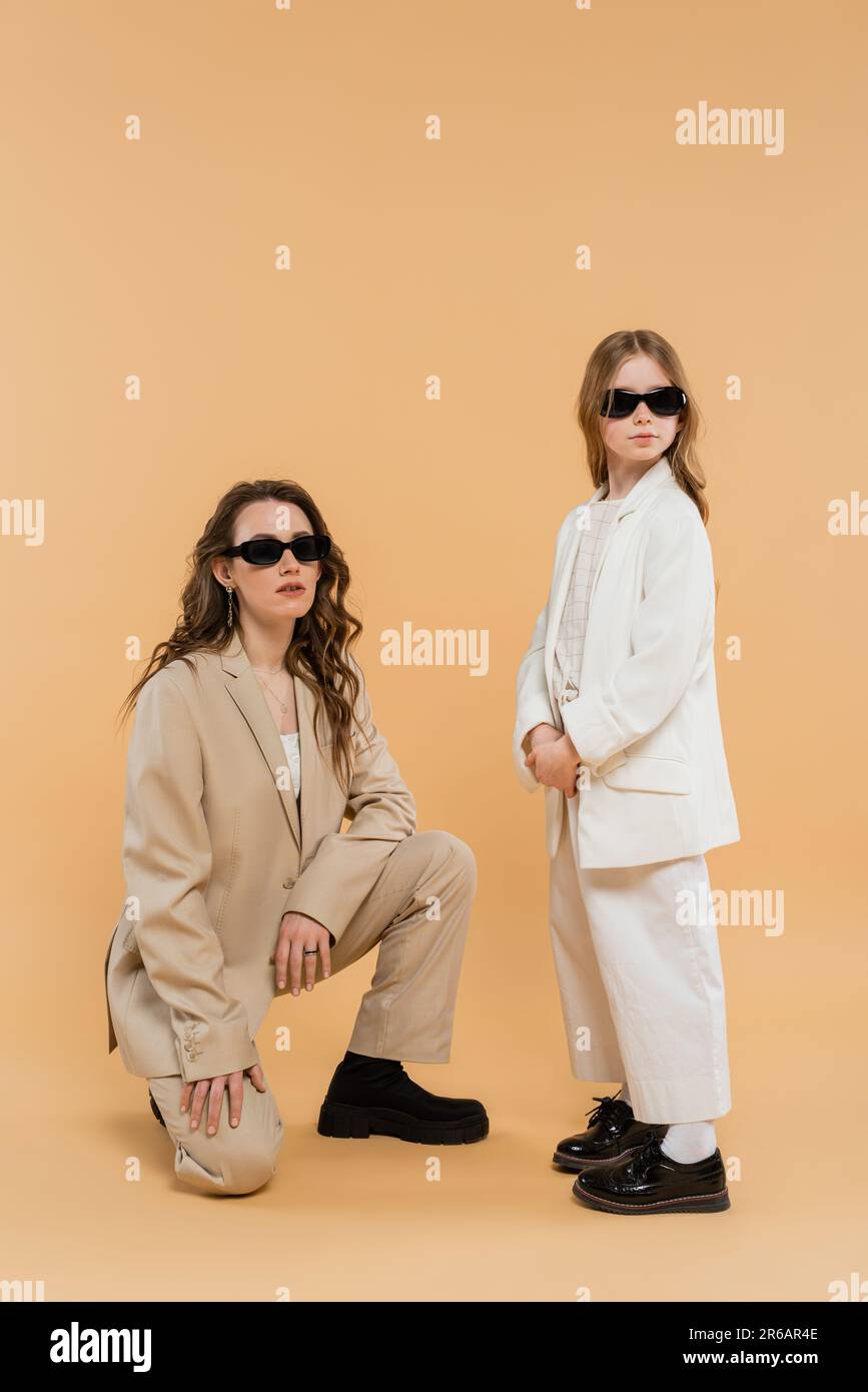 modern family, stylish mother and daughter in suits and sunglasses ...