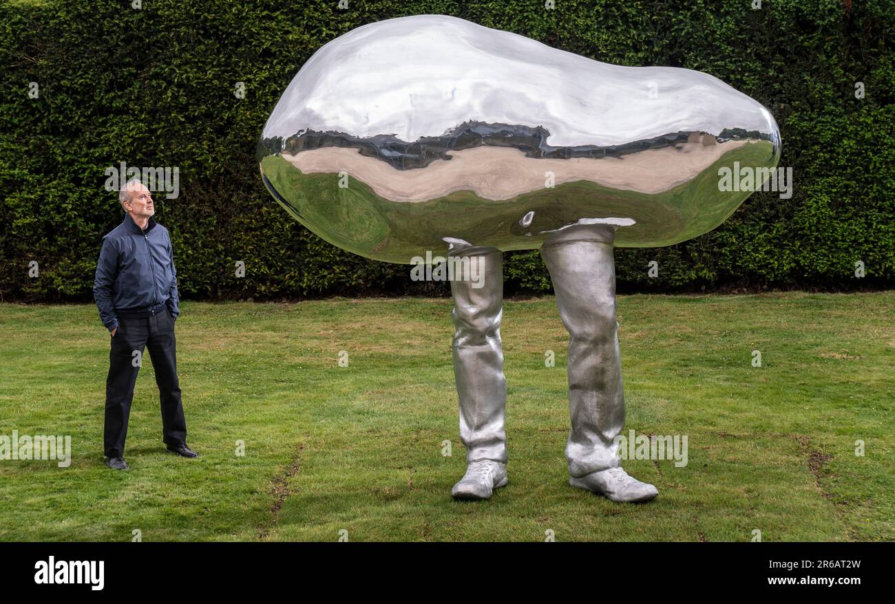 Austrian artist Erwin Wurm with his work Big Hypnosis, 2008, as he ...