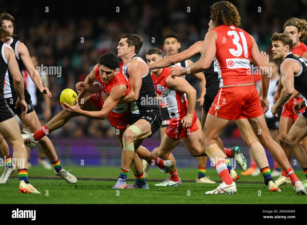 Sydney, Australia. 08th June, 2023. Justin McInerney of the Swans hand balls as he's tackled by ...