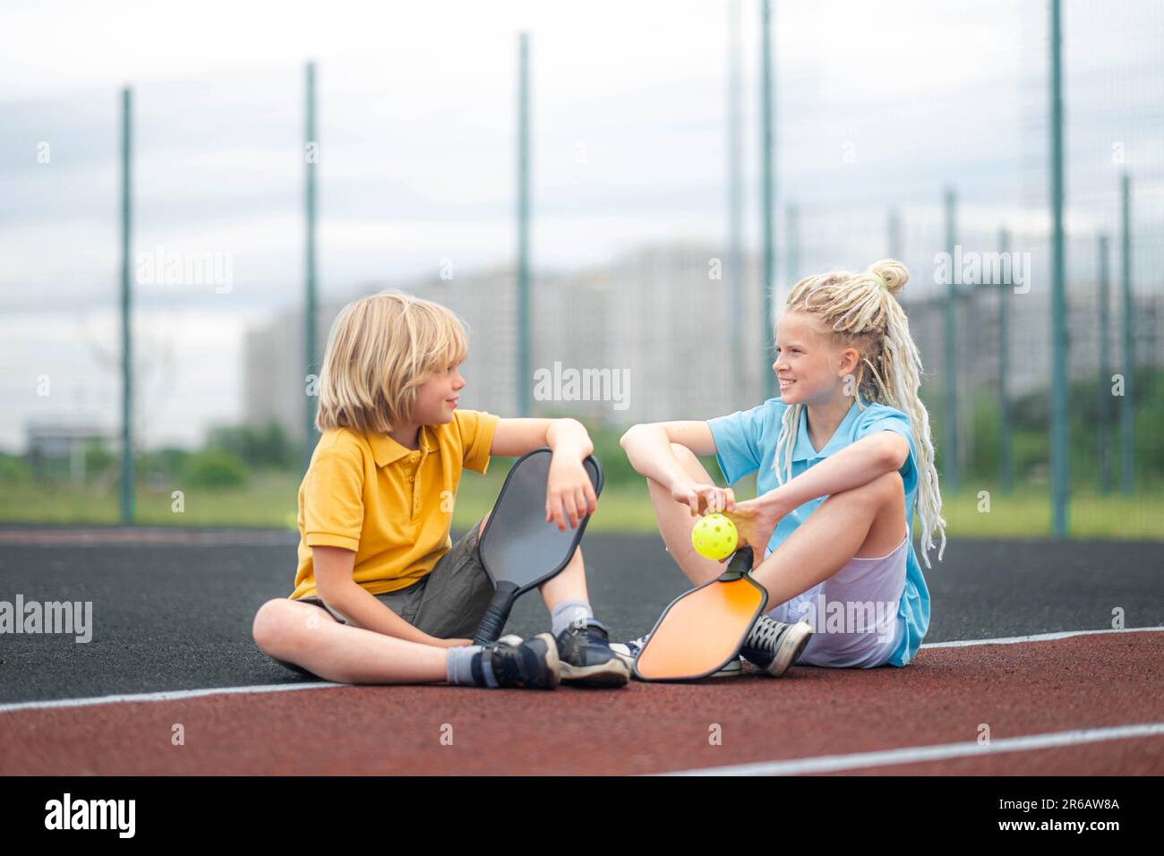 pickleball game, relaxing pickleball players kids boy and girl with ...