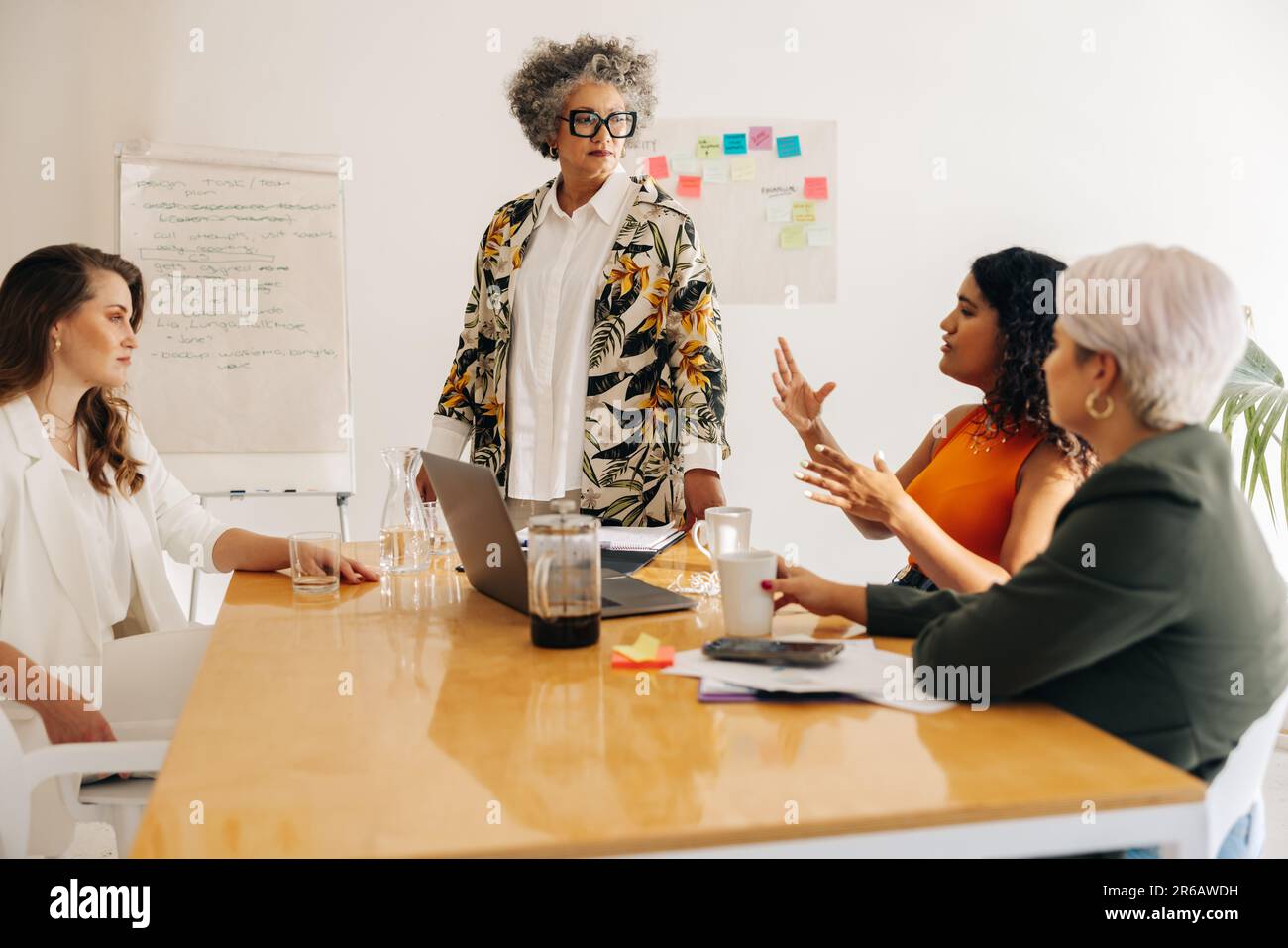 Group of diverse businesswomen having a discussion during a meeting ...
