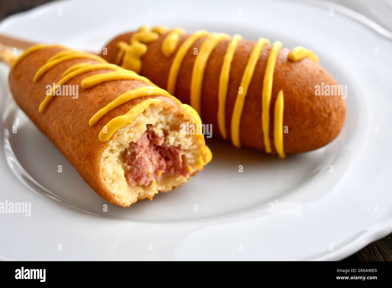 Corn dogs with mustard Stock Photo - Alamy