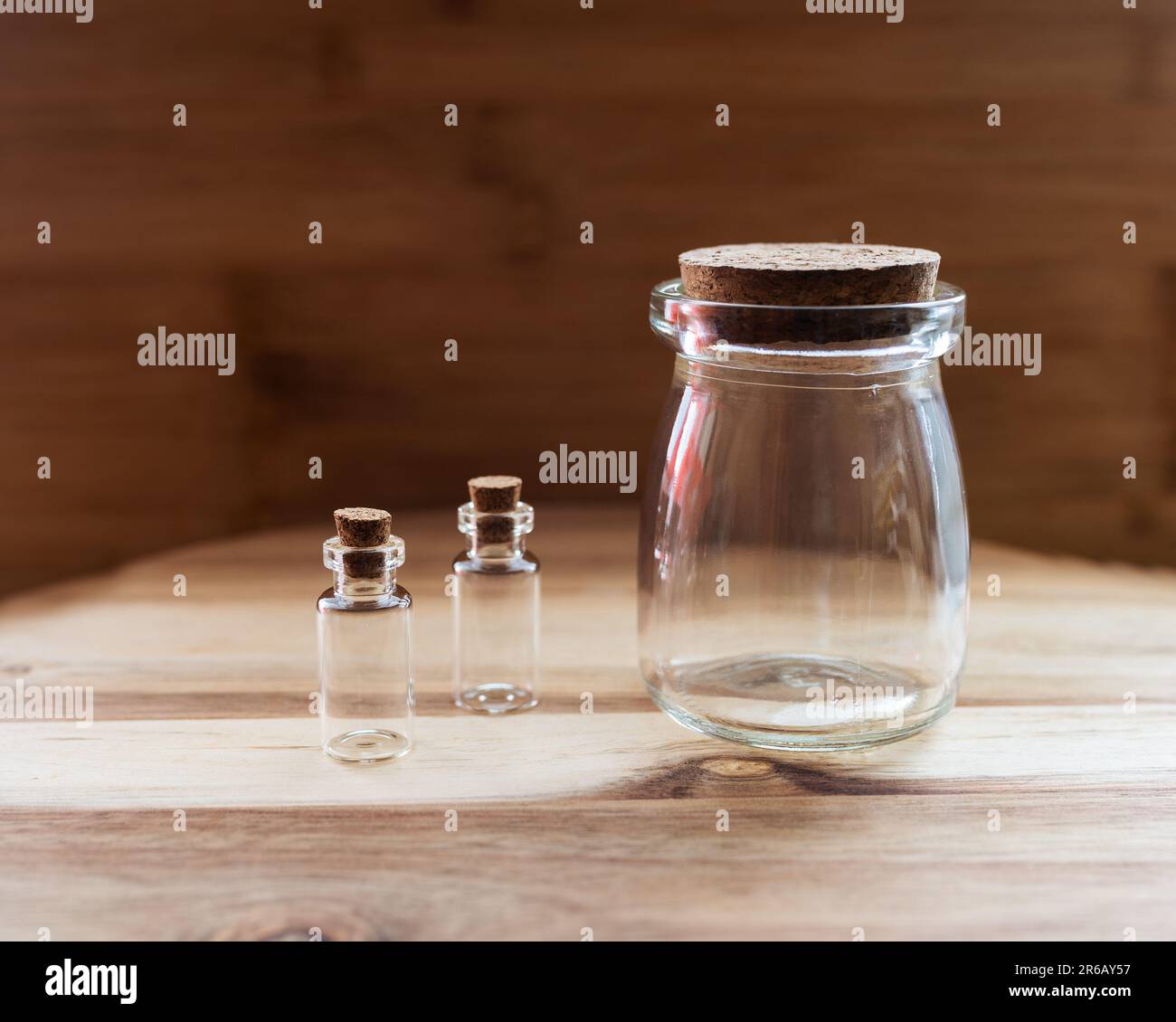 Small and empty glass jar and vials. Selective focus Stock Photo - Alamy