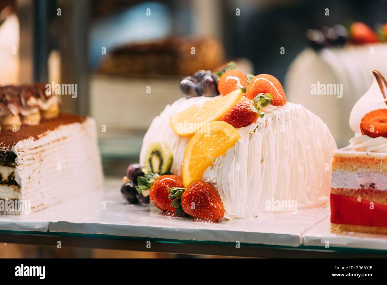 cake with strawberries, yummy assortment baked pastry in bakery ...