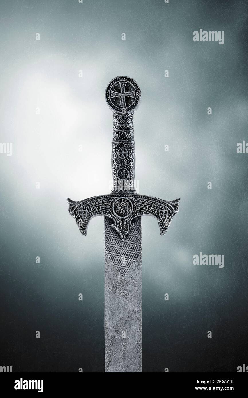 Medieval sword over dark misty background Stock Photo - Alamy