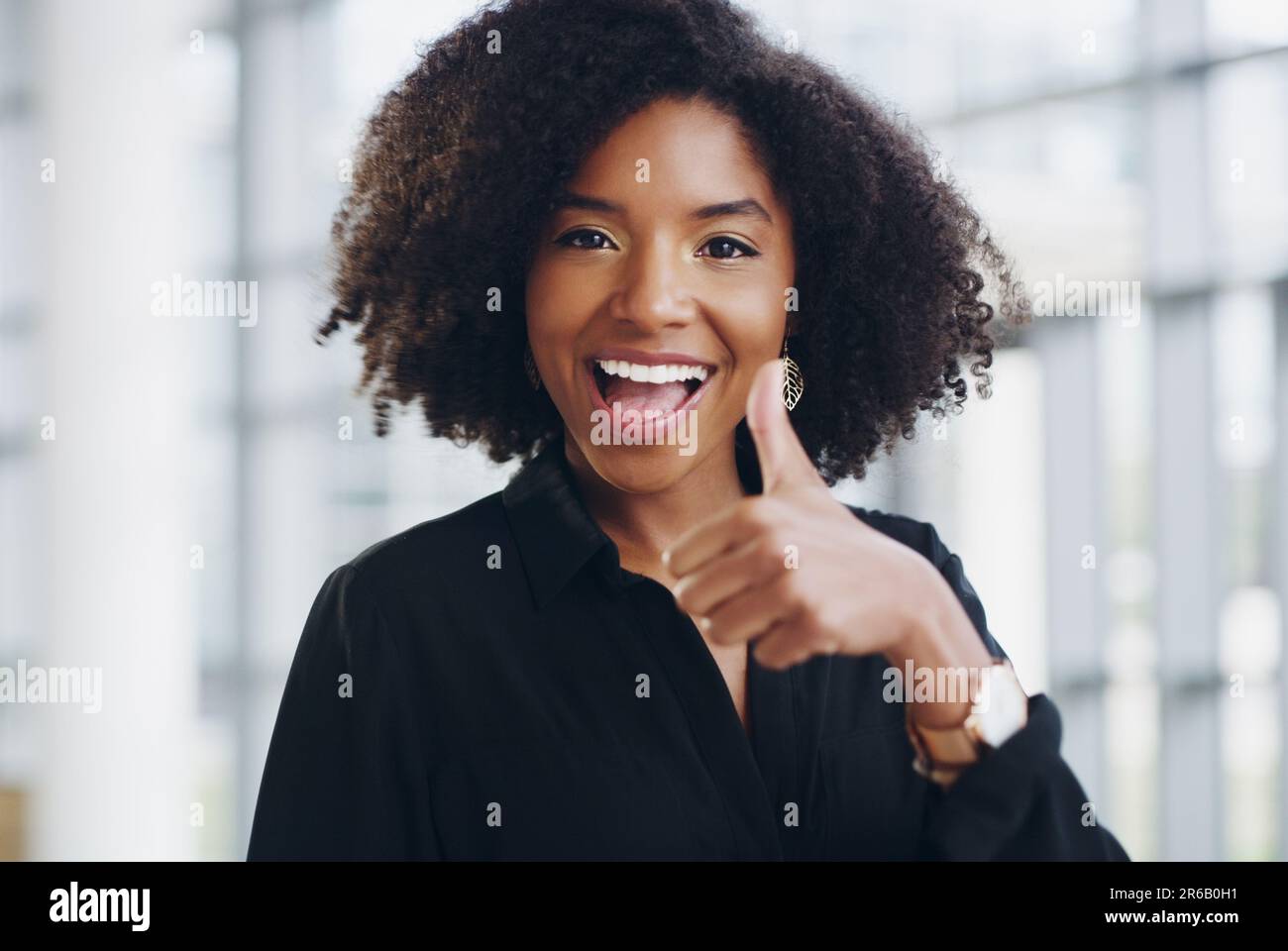 Black woman in business, face and thumbs up with smile, support and ...