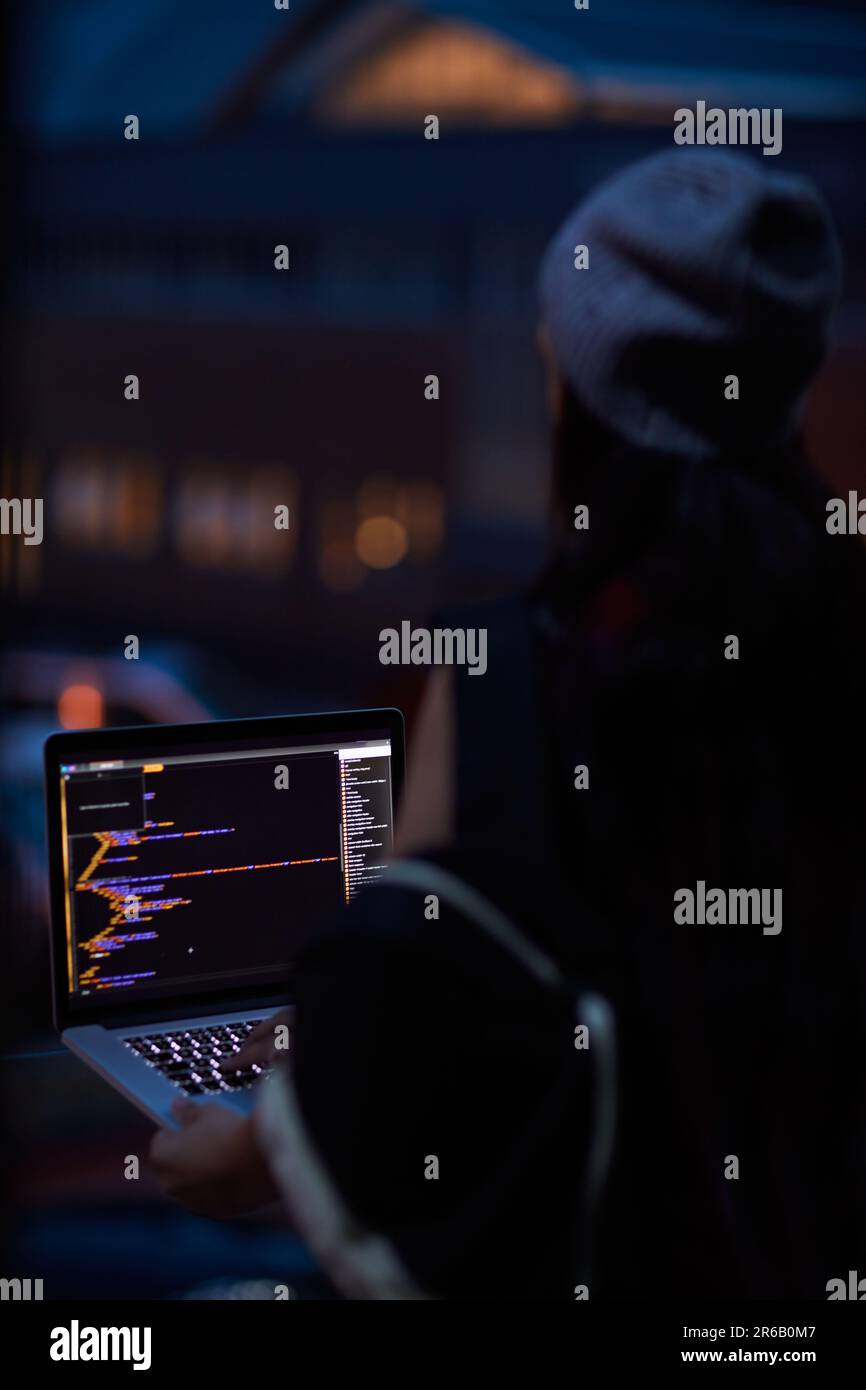 Hacker, night and programming with person and laptop screen for ...