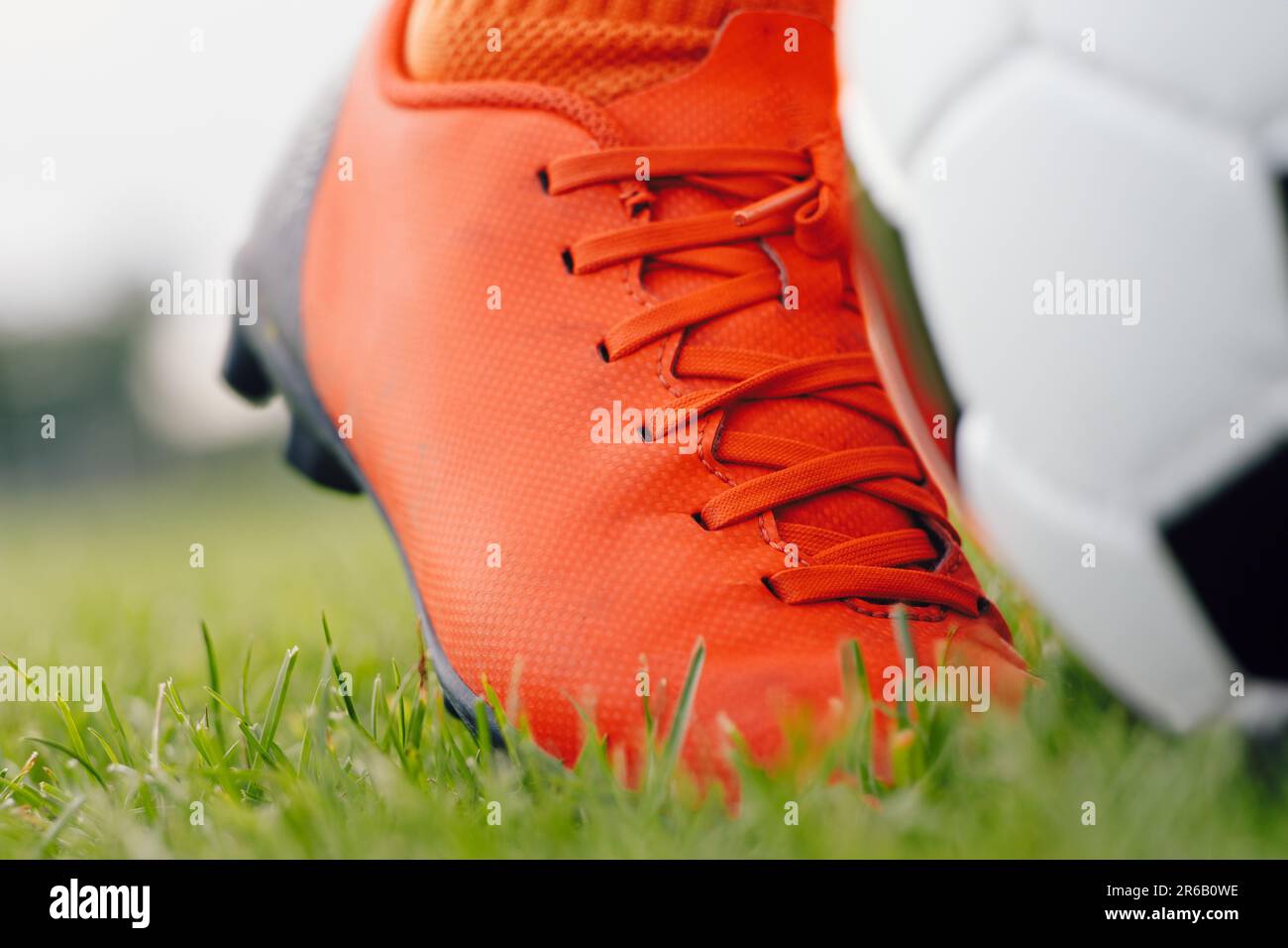 Football soccer ball at the kickoff of a game. Soccer playerwearing ...