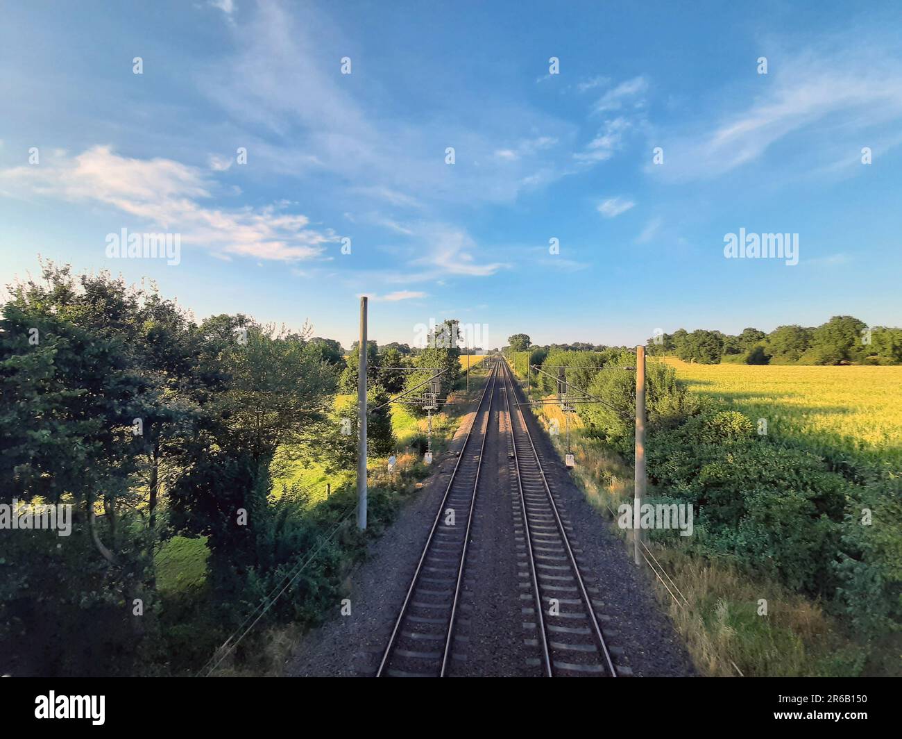 A railway among nature and farmlands Stock Photo - Alamy