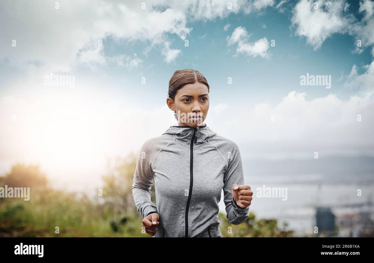 Training, sky and Indian woman with exercise, running and fitness with ...