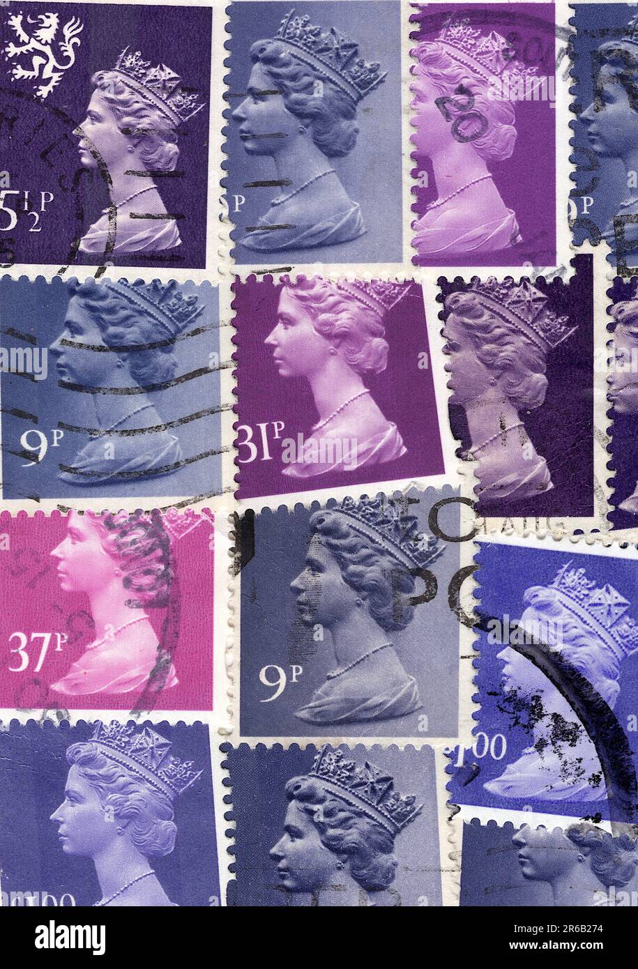 A montage of purple vintage postage stamps from the United Kingdom ...