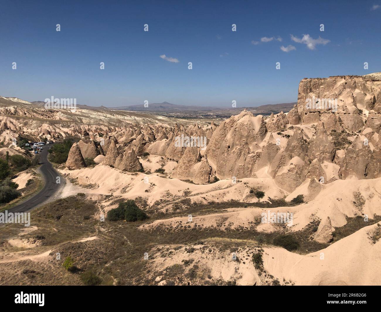 A scenic view of a desert landscape in Cappadocia, Turkey Stock Photo ...