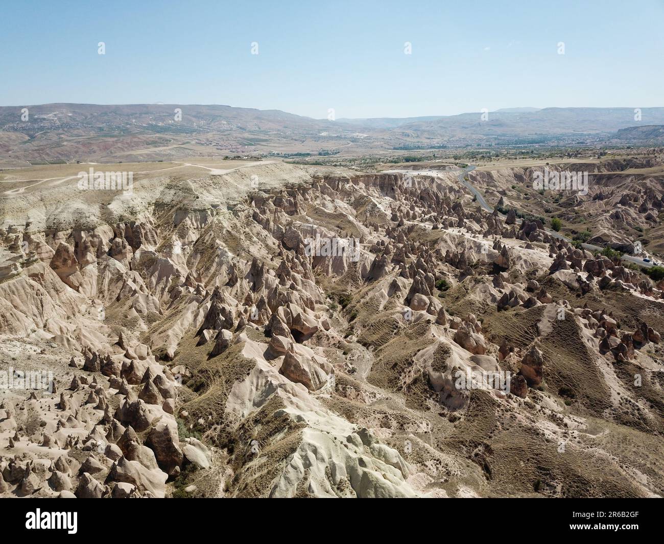 A scenic view of a desert landscape in Cappadocia, Turkey Stock Photo ...