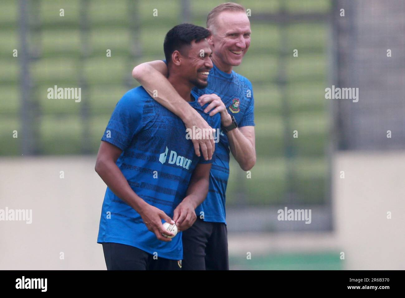 Pace bowling coach Allan Donald (R) along fast bowler Mustafizur Rahman ...