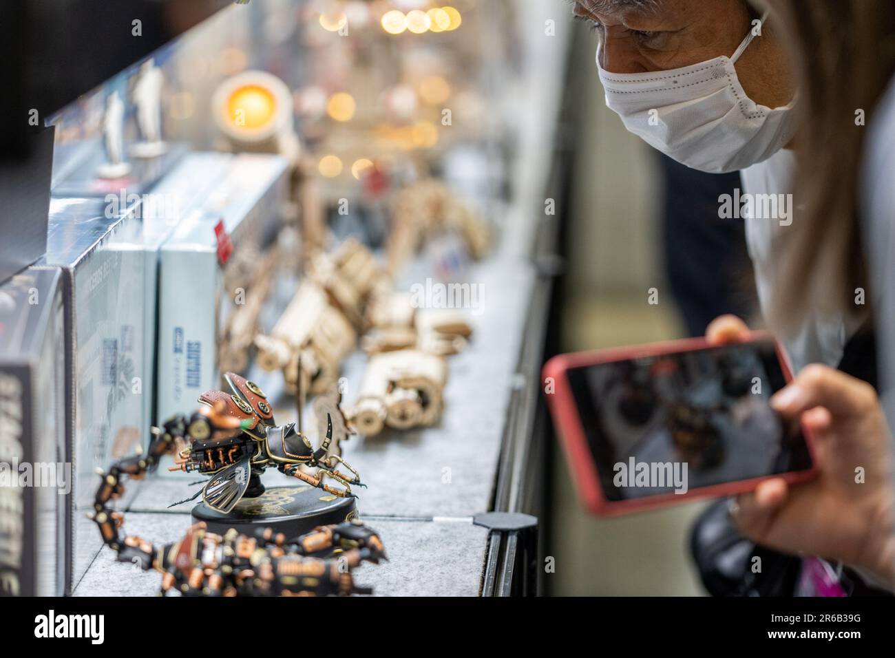 Tokyo, Japan. 8th June, 2023. A visitor looks at toys exhibited at the ...