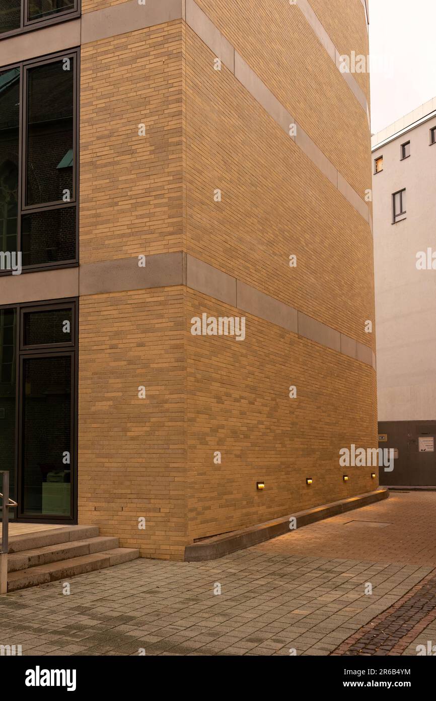 An exterior view of a modern office building featuring an entrance with ...