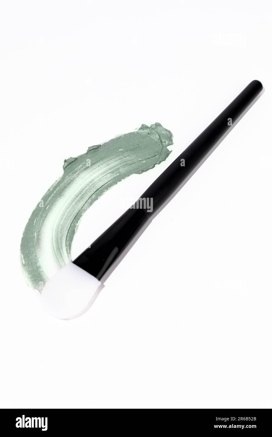 Minimal White Background Photo of Black and White Silicon Face Mask Application Brush With a ...