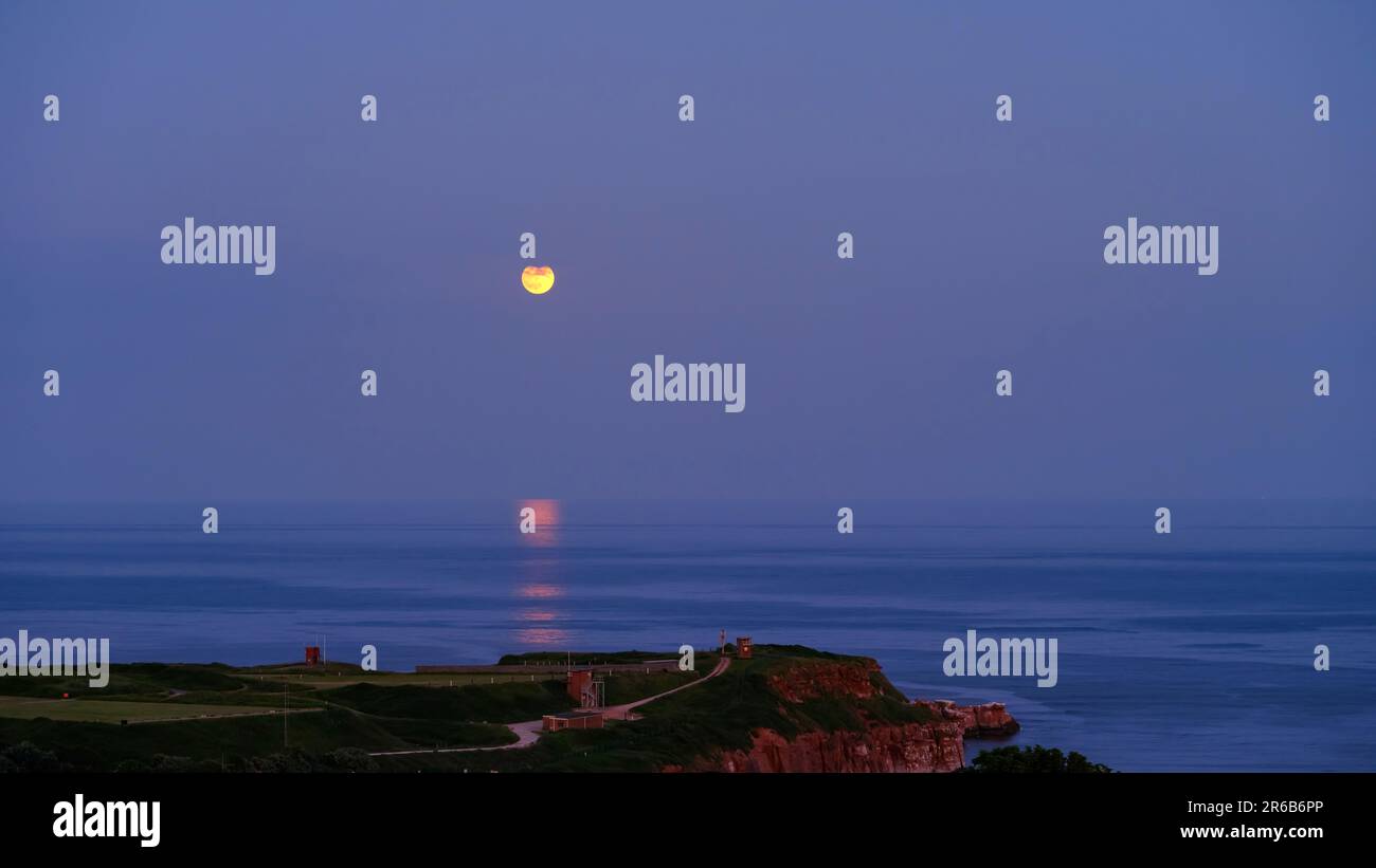 MOON RISE OVER DEVON CLIFFS Stock Photo - Alamy