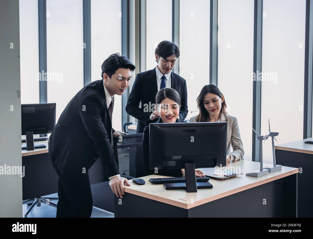 Renewable energy analyst team conduct research using data and ...