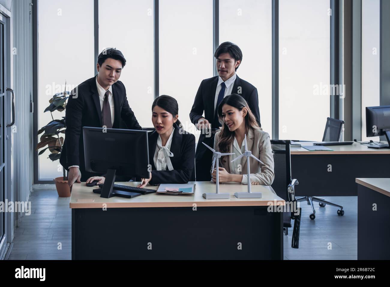 Renewable energy analyst team conduct research using data and statistics to brainstorm, assess ...