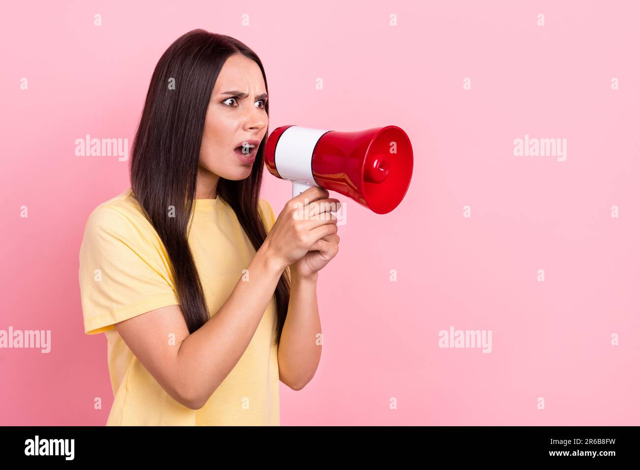 Photo of shocked angry lady wear yellow t-shirt shouting loud speaker ...