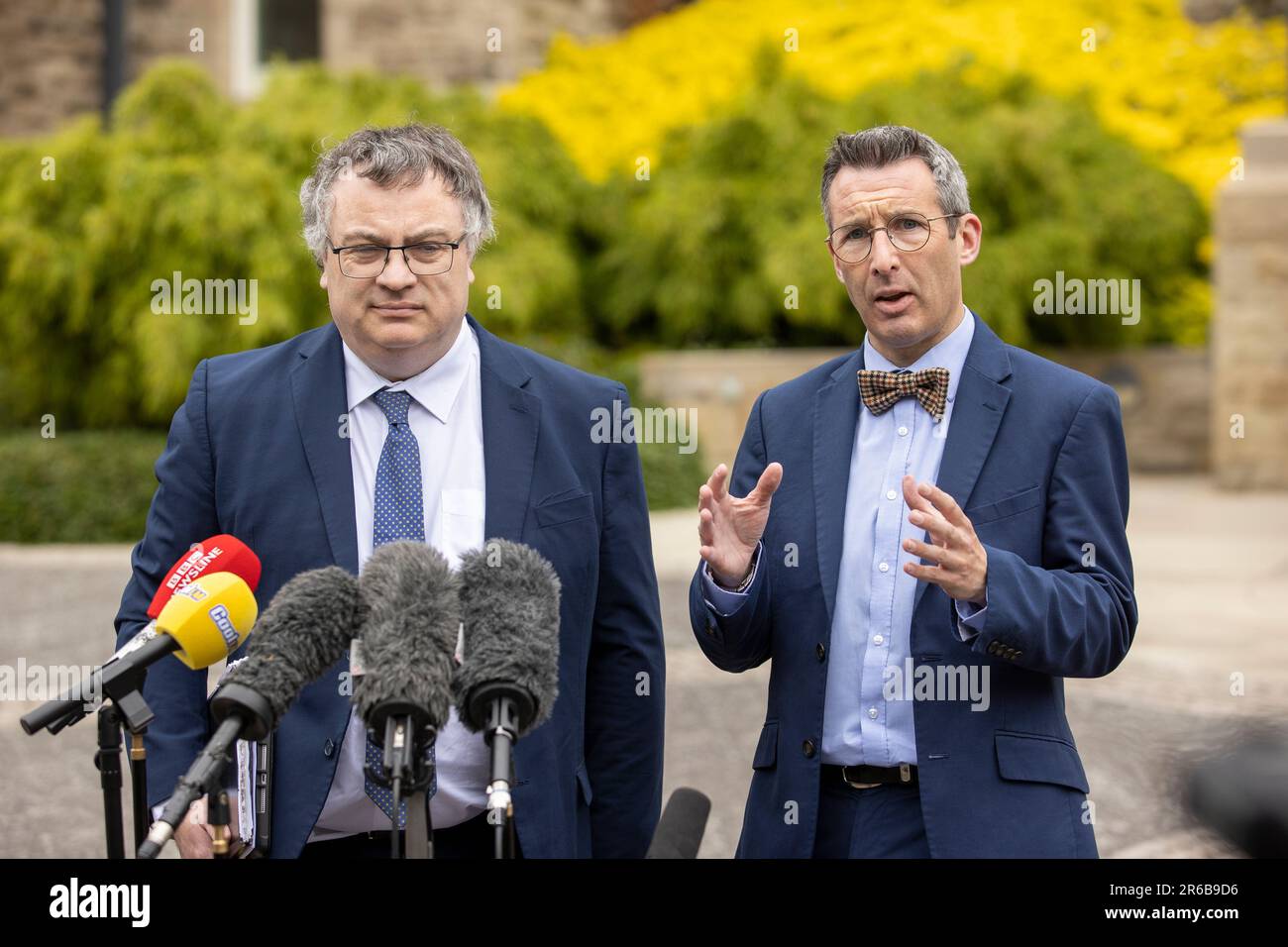 Alliance Party's Stephen Farry (left) with party colleague Andrew Muir ...